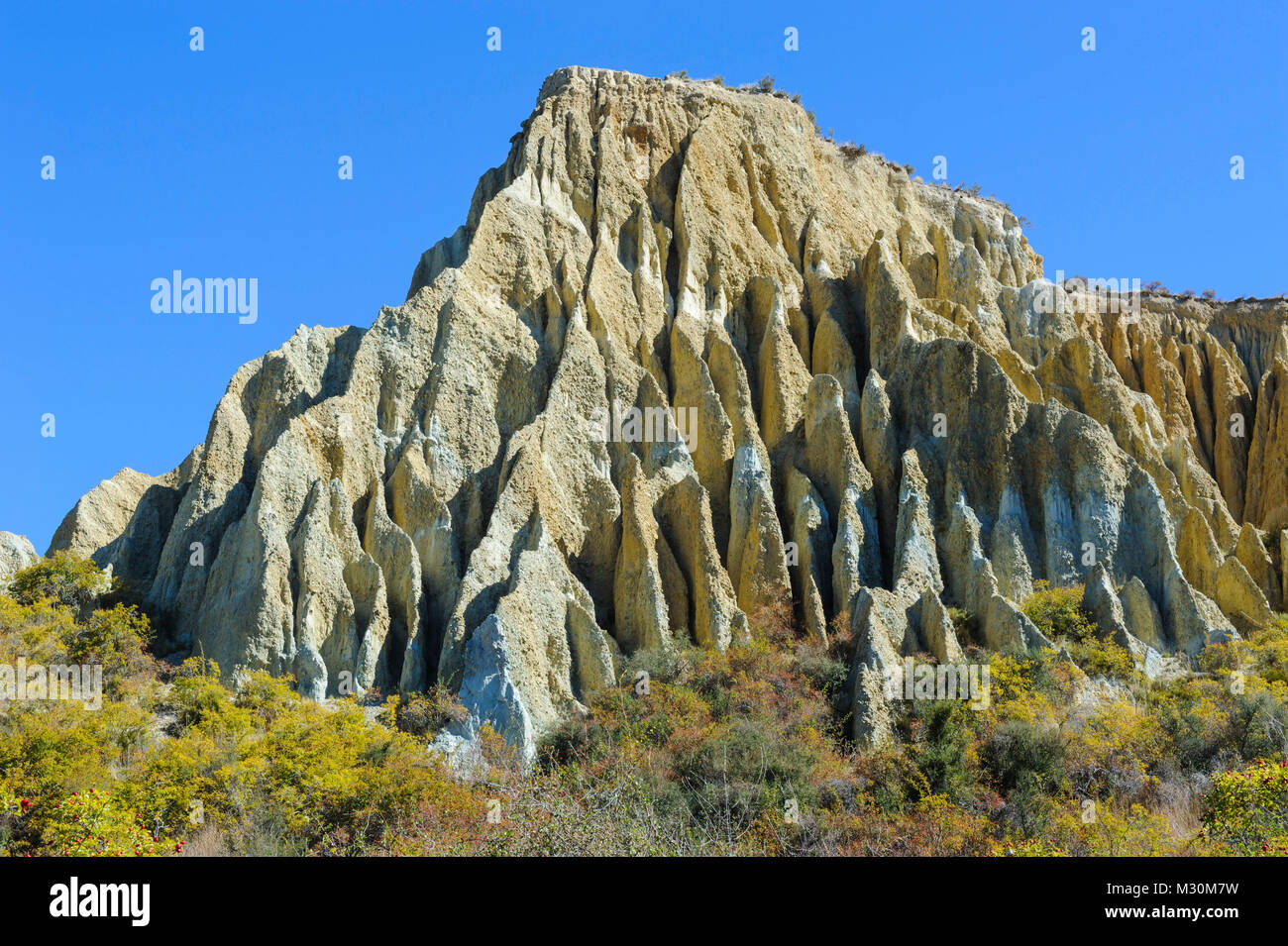 Huge sharp pinnacles of the Omarama clay cliffs, South island, New ...