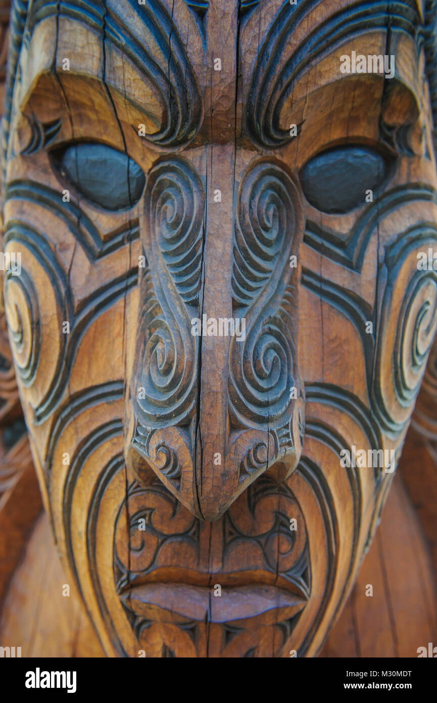 Traditional wood carved mask in the Te Puia Maori Cultural Center ...