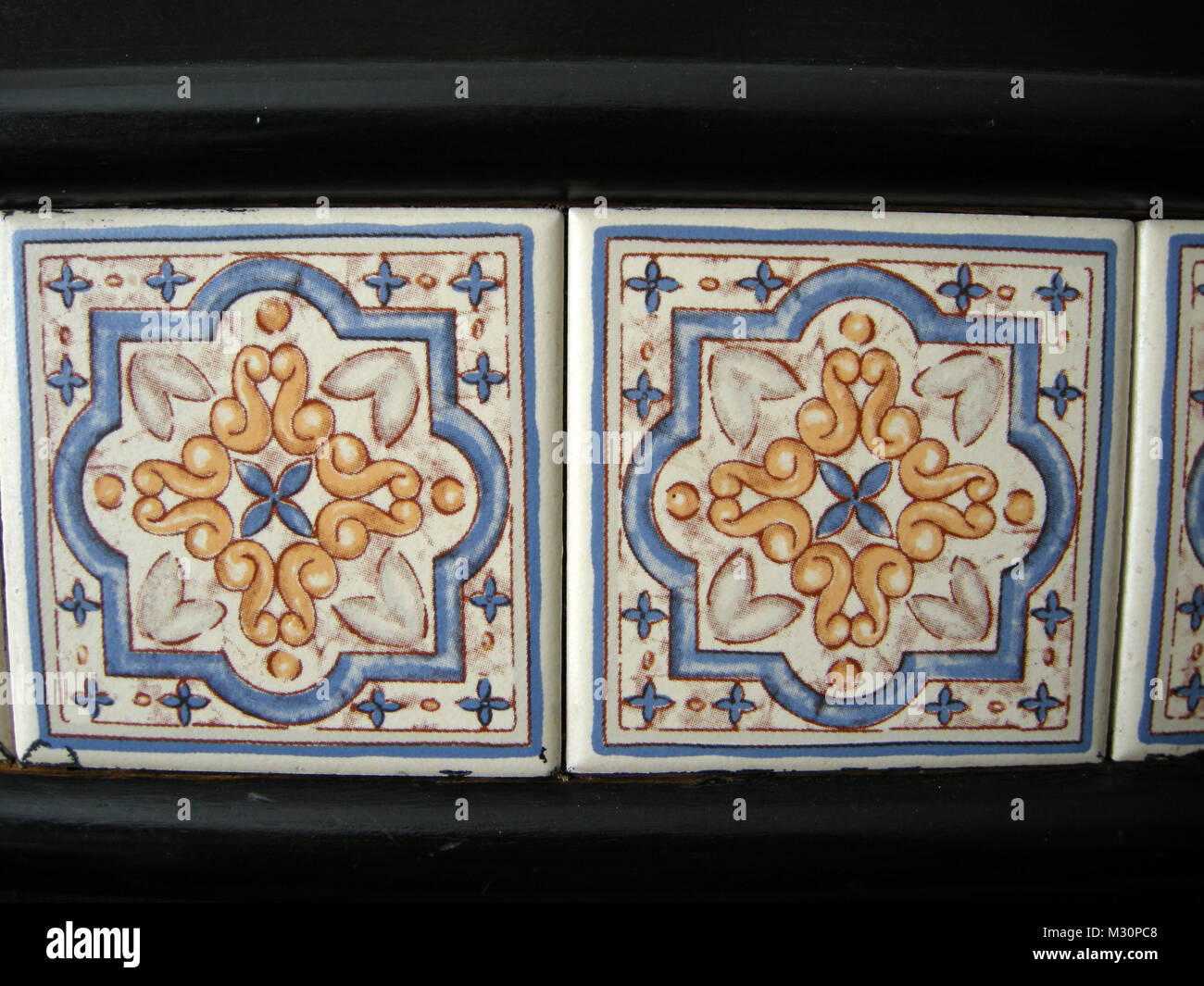 Colourful ceramic tiles decorate this wall here in Georgetown, Malaysia ...