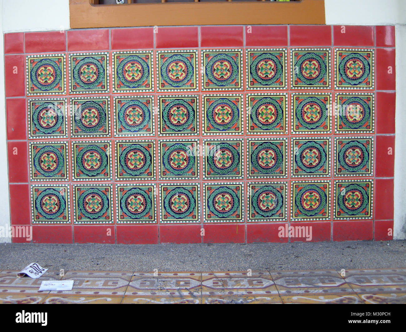 Colourful ceramic tiles decorate this wall here in Georgetown, Malaysia ...