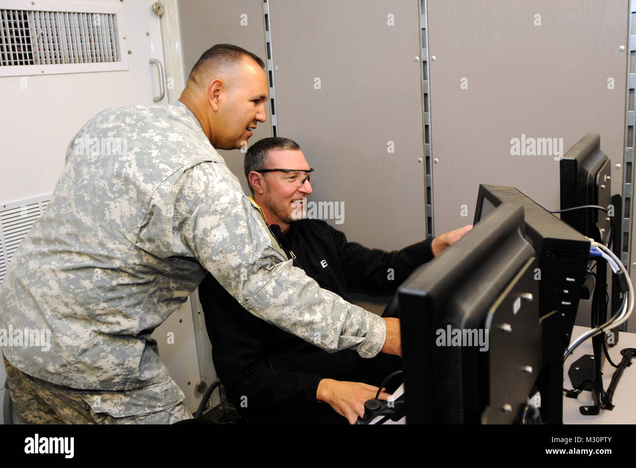 Sgt. Luis Renteria, 136th Regiment, Texas Army National Guard, explains ...