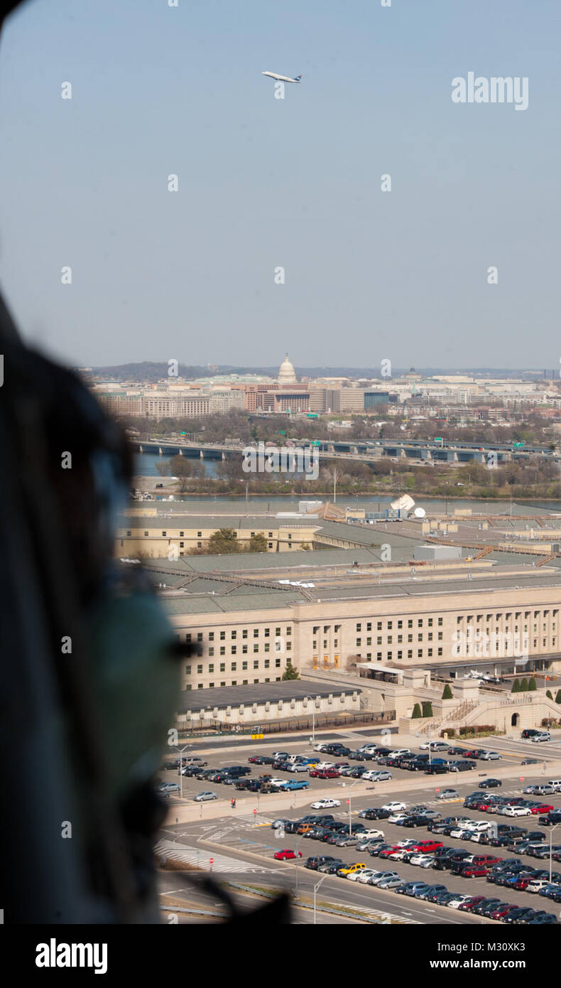 DCARNG UH-60 flies past the Pentagon with the Capitol Building in the ...