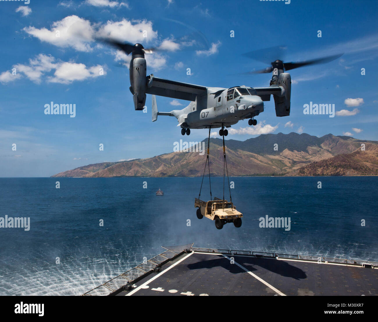 MV-22B Osprey conducts the first external lift of a Humvee from the ...