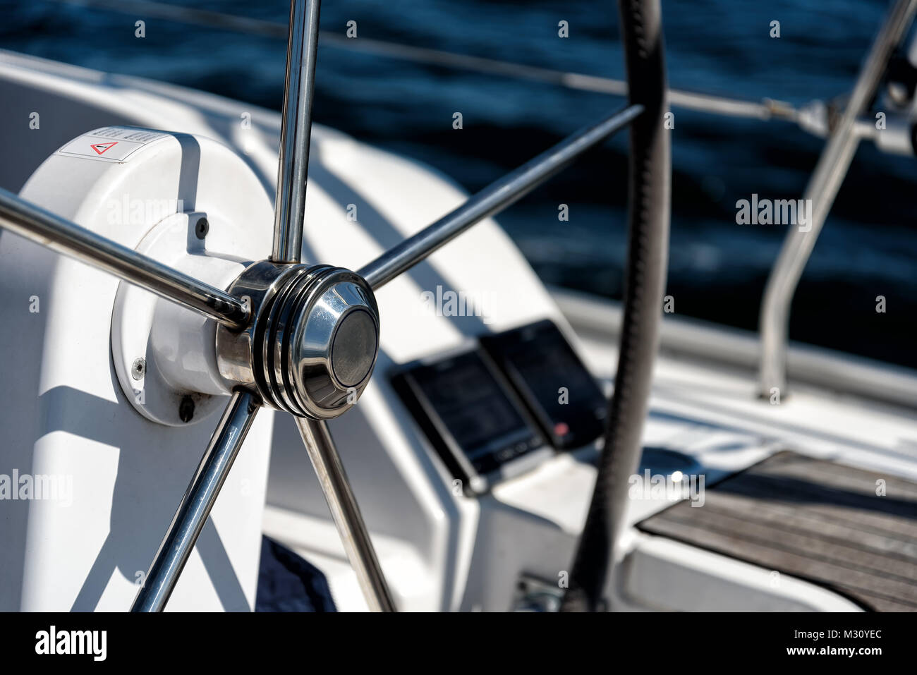 steering wheel in the cockpit of a sailing yacht Stock Photo - Alamy