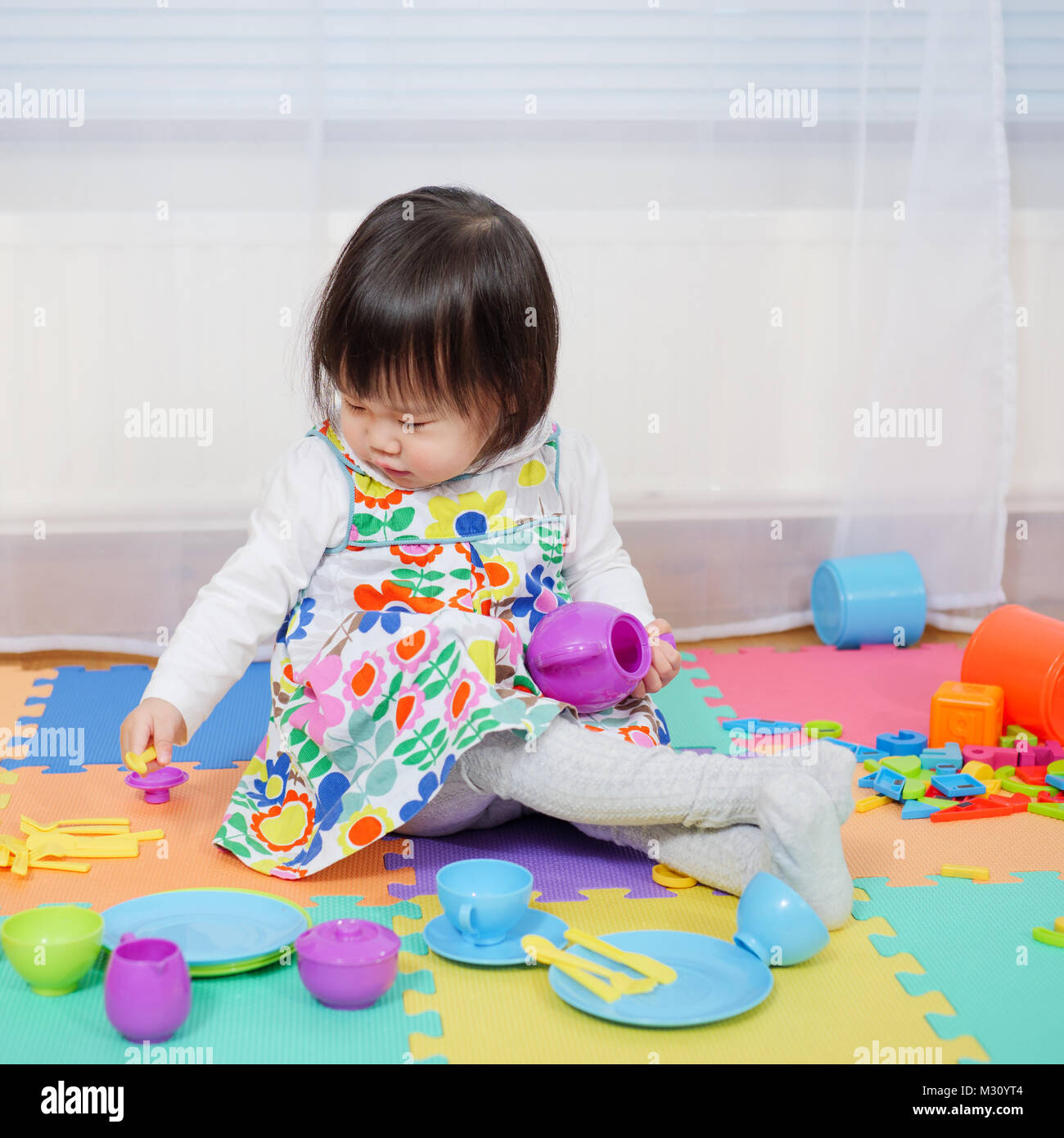 baby girl pretend play food toy Stock Photo - Alamy