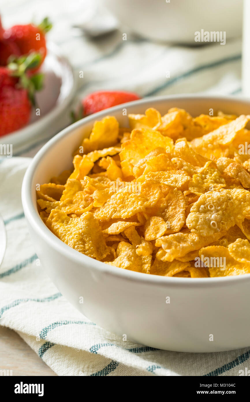 Healthy Corn Flakes with Milk for Breakfast with Fruit Stock Photo - Alamy