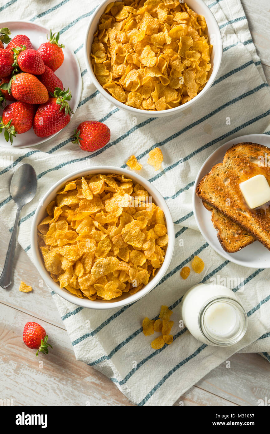 Healthy Corn Flakes with Milk for Breakfast with Fruit Stock Photo - Alamy
