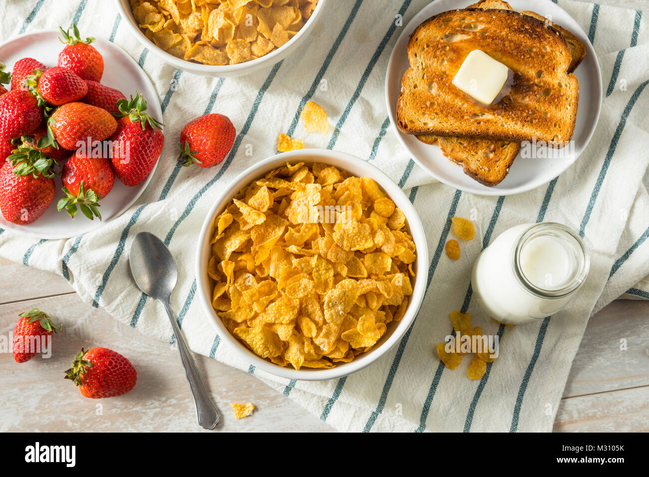 Healthy Corn Flakes with Milk for Breakfast with Fruit Stock Photo - Alamy