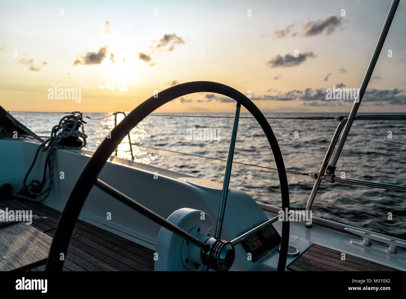 steering wheel in the cockpit of a sailing yacht Stock Photo - Alamy
