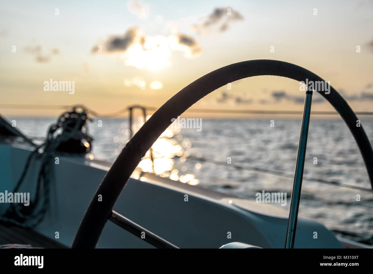 steering wheel in the cockpit of a sailing yacht Stock Photo - Alamy