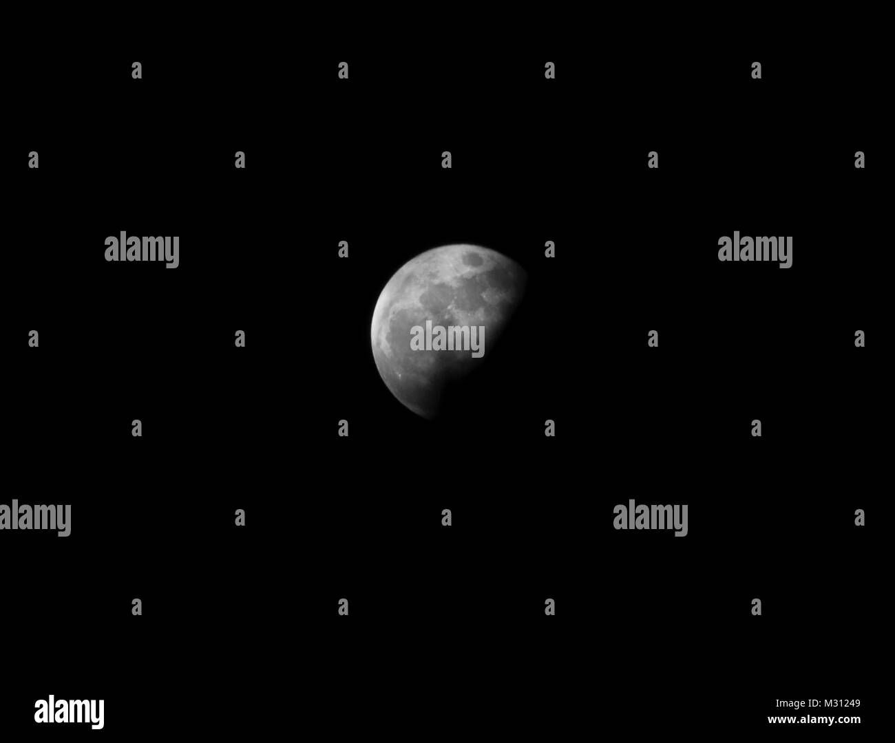 Full moon with dark shadow on lower right quarter Stock Photo - Alamy