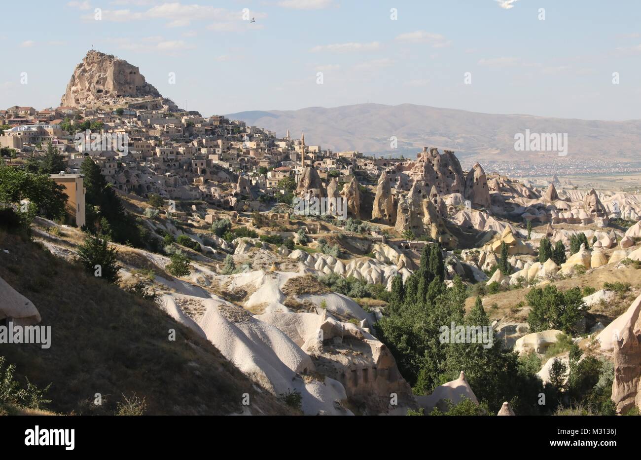 Tourists visiting some of the famous Fairy chimneys in Cappadocia which ...