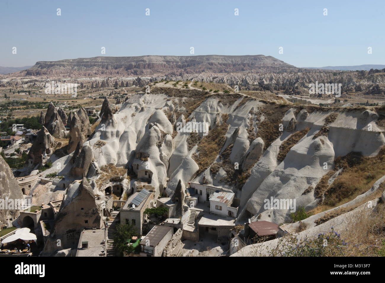 Tourists visiting some of the famous Fairy chimneys in Cappadocia which ...