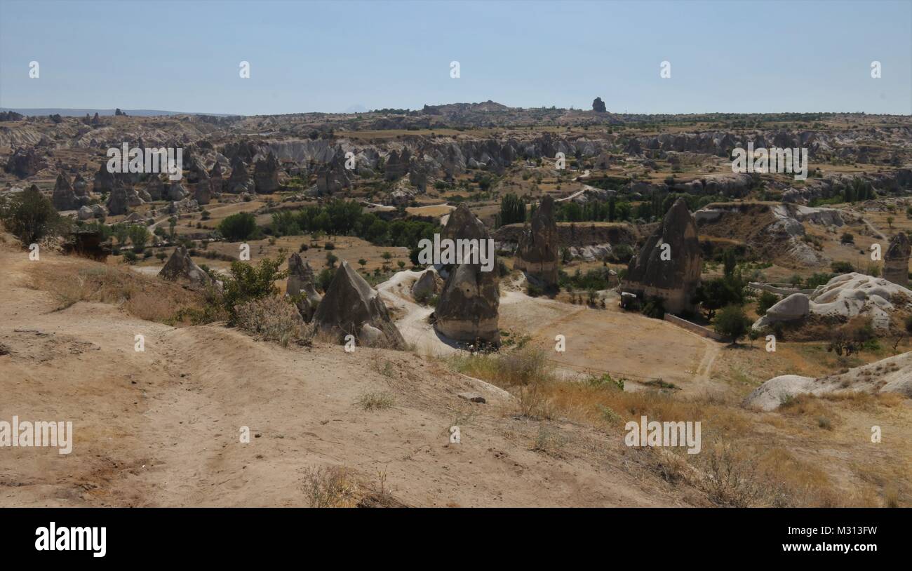 Tourists visiting some of the famous Fairy chimneys in Cappadocia which ...