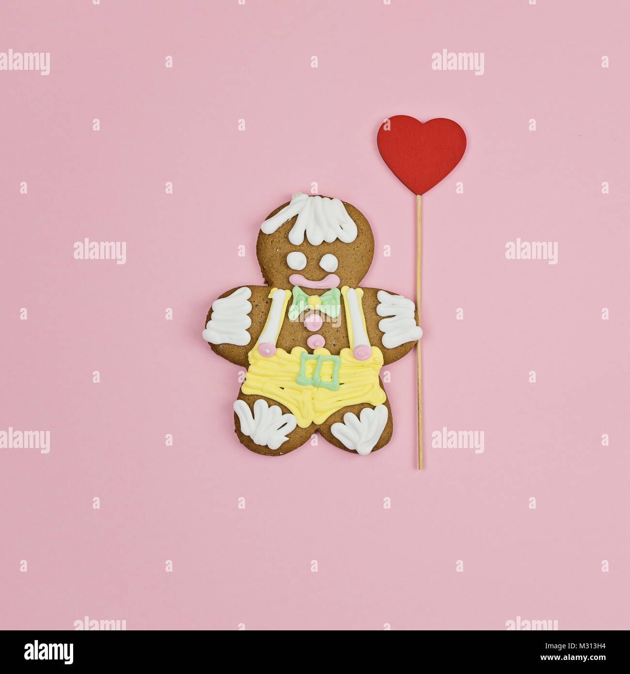 Large gingerbread man cookie with big red heart, Valentine's day ...