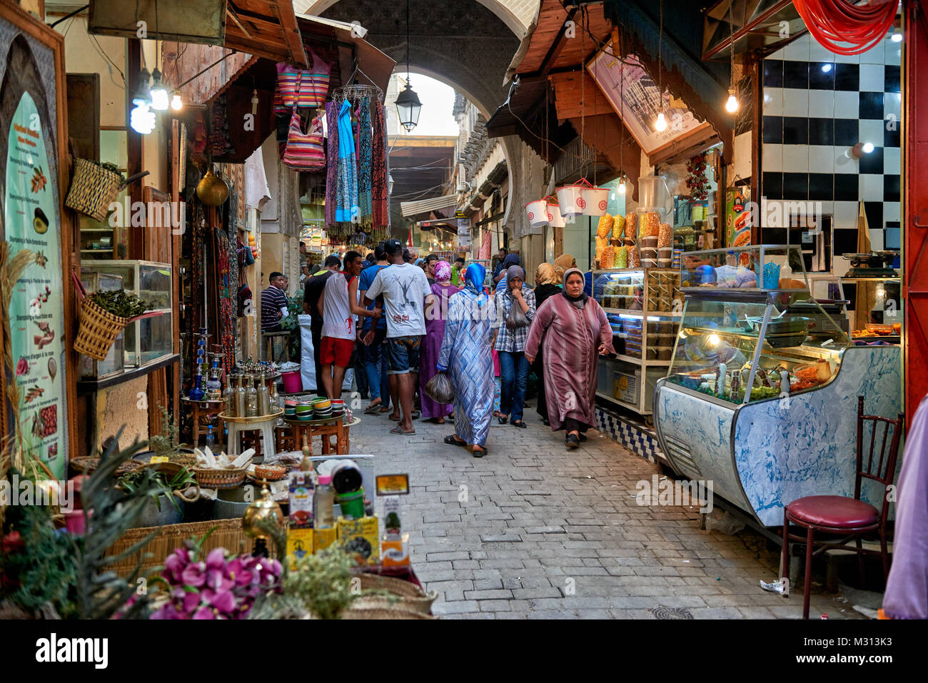 market stalls with food in the narrow alleys in old town (medina) of ...