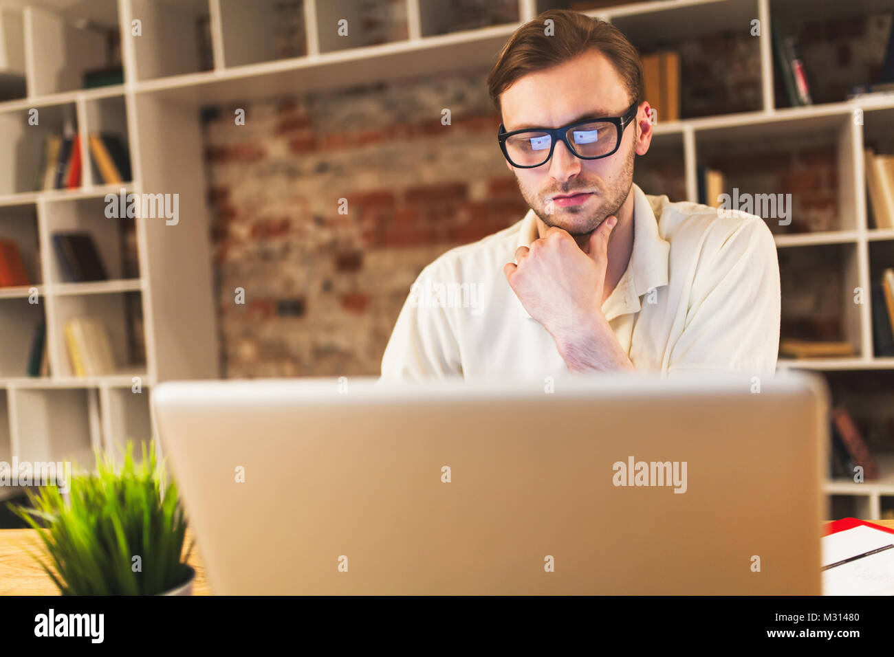 Young man with a laptop Stock Photo - Alamy