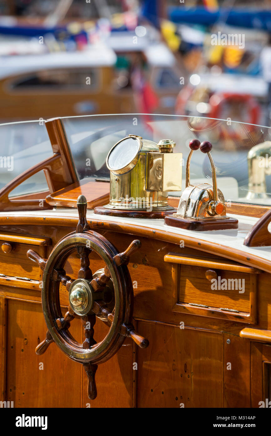 Small wooden steering wheel inside a boat Stock Photo - Alamy