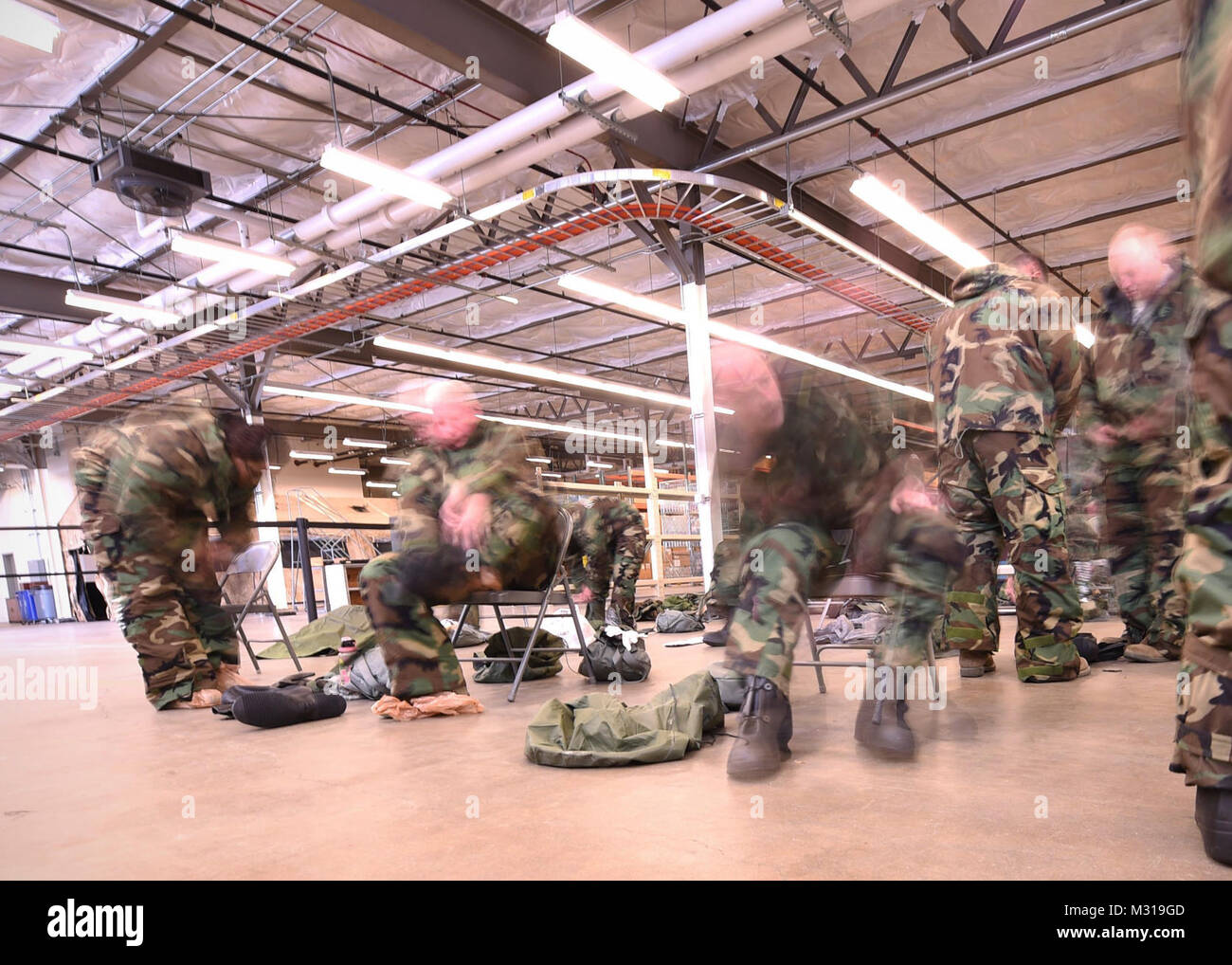 Airmen don mission oriented protective posture [MOPP] gear at Grissom ...