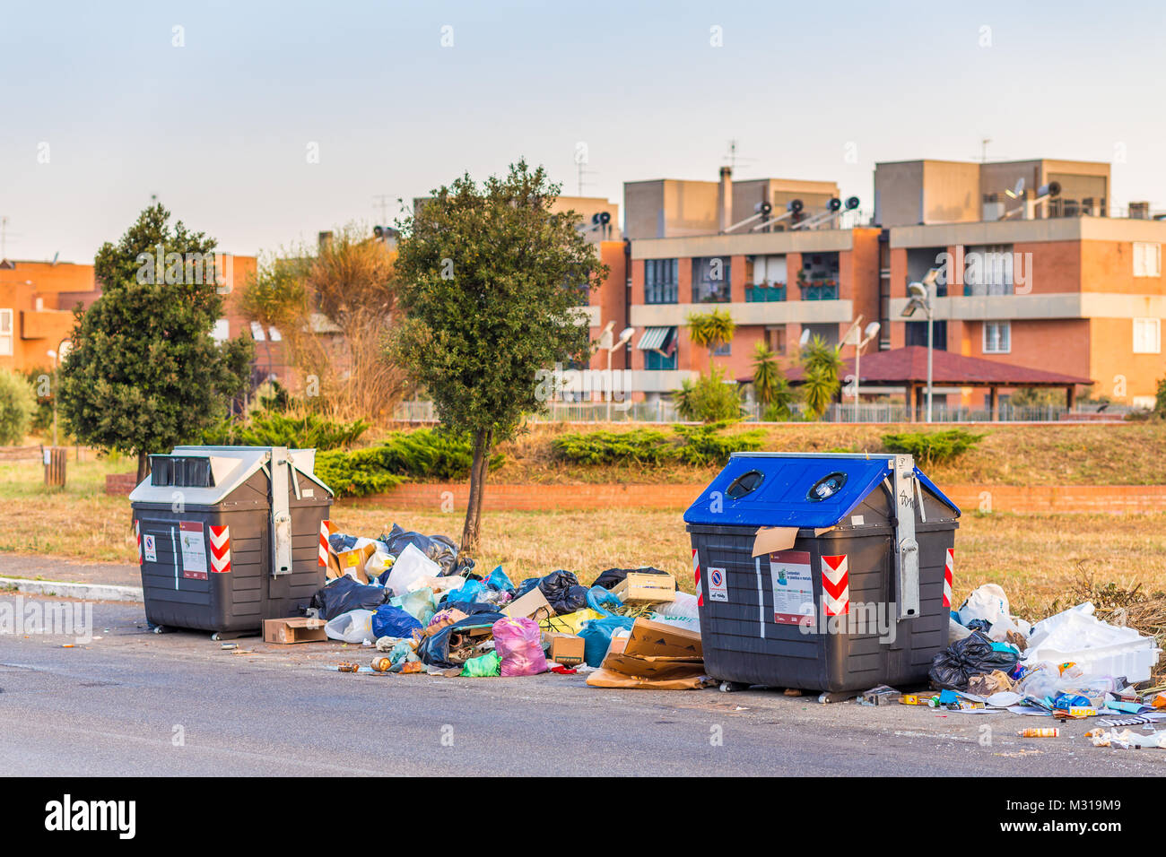 ROME, ITALY - JUNE 23, 2017: Heaps of rubbish left near the garbage ...