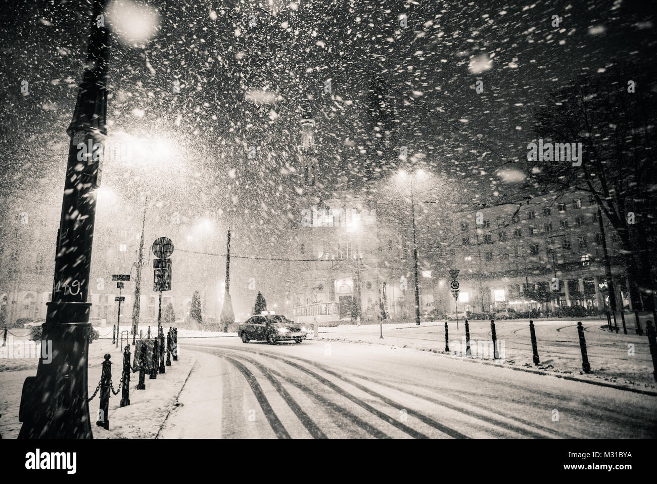 Severe powerful snow in Warsaw. One snowy winter night in the city ...