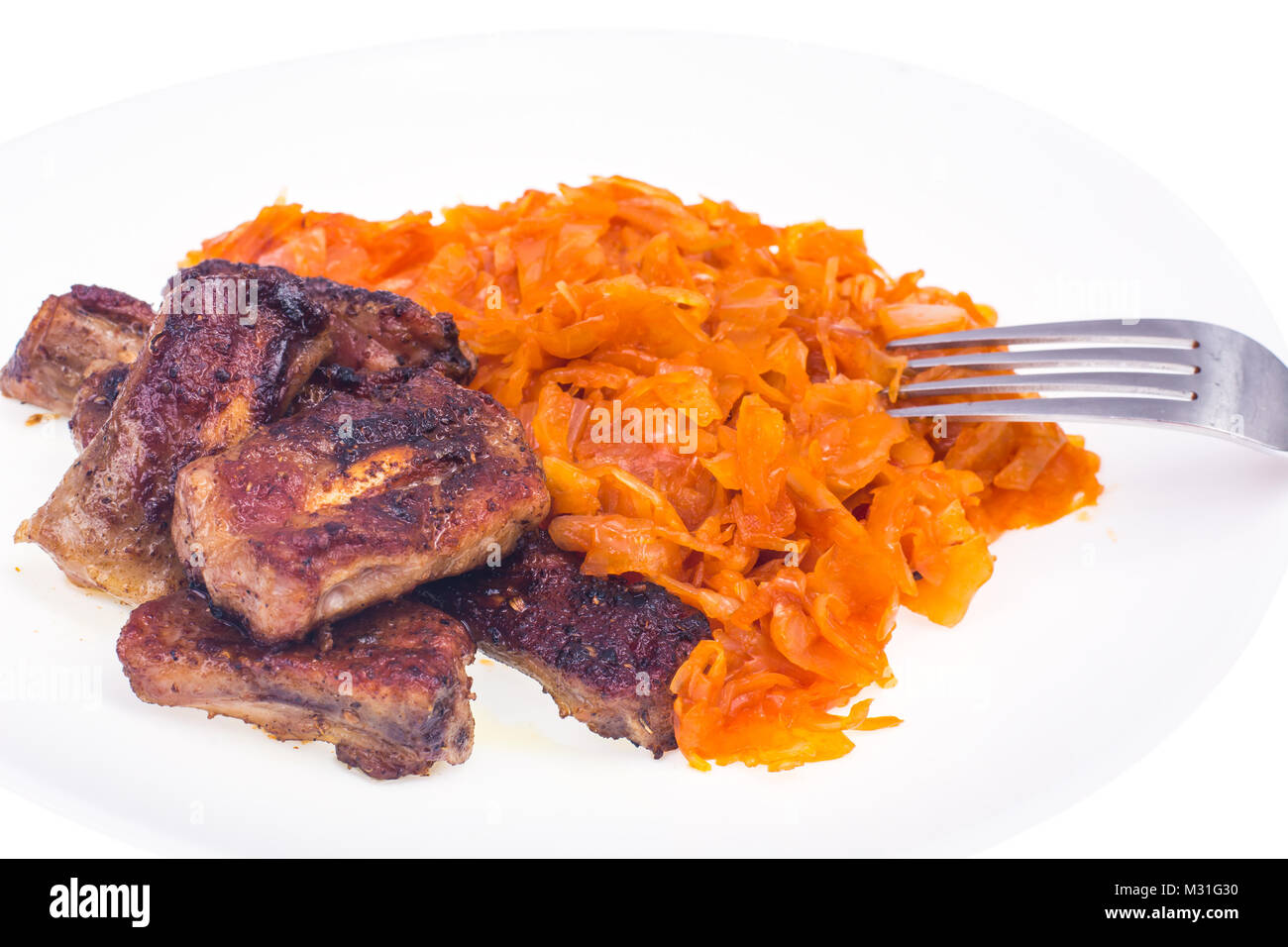 Stewed cabbage with fried ribs Stock Photo - Alamy