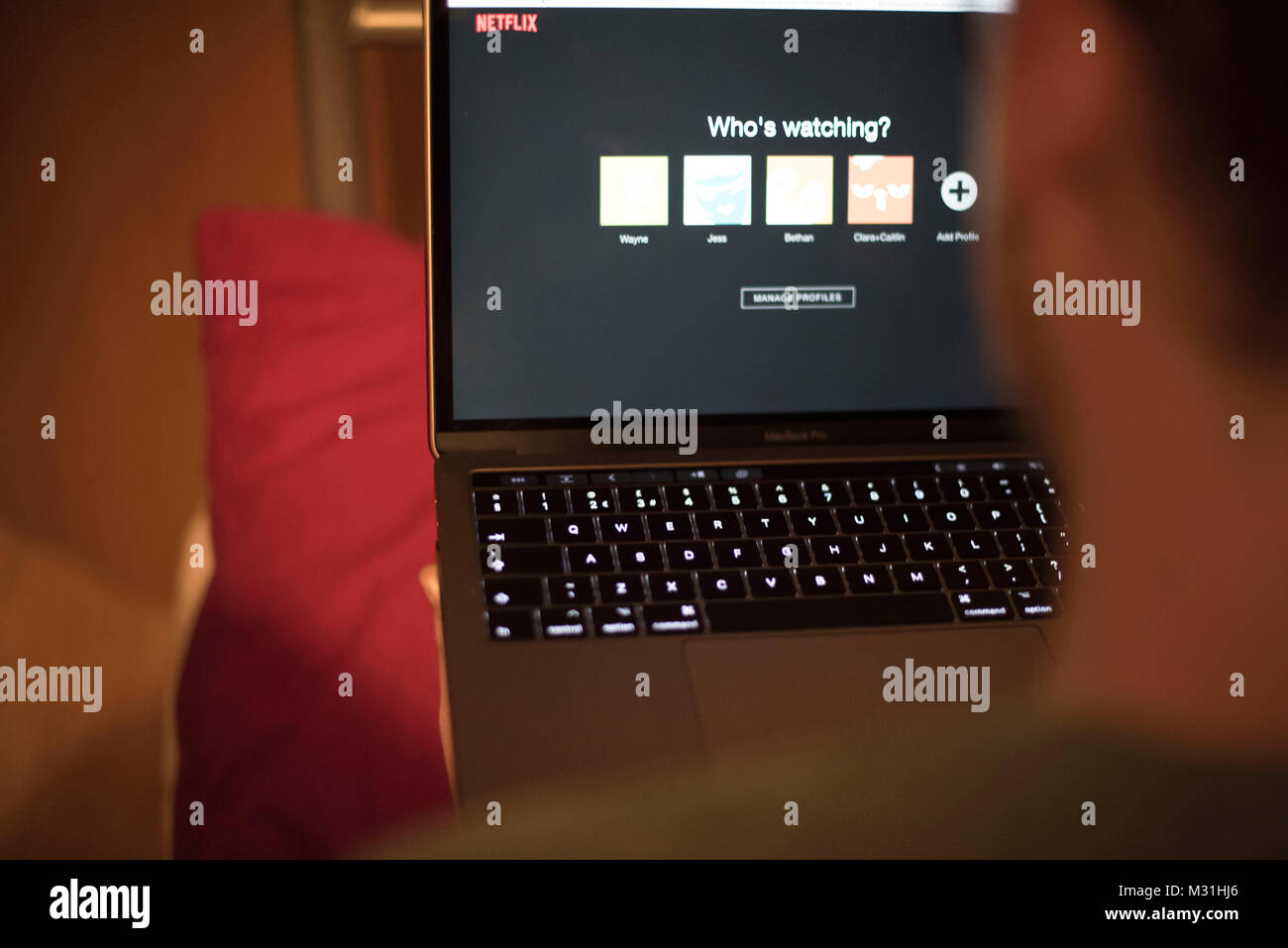 CARDIFF, UK. 6 February 2018. Young man using Netflix. With the ...