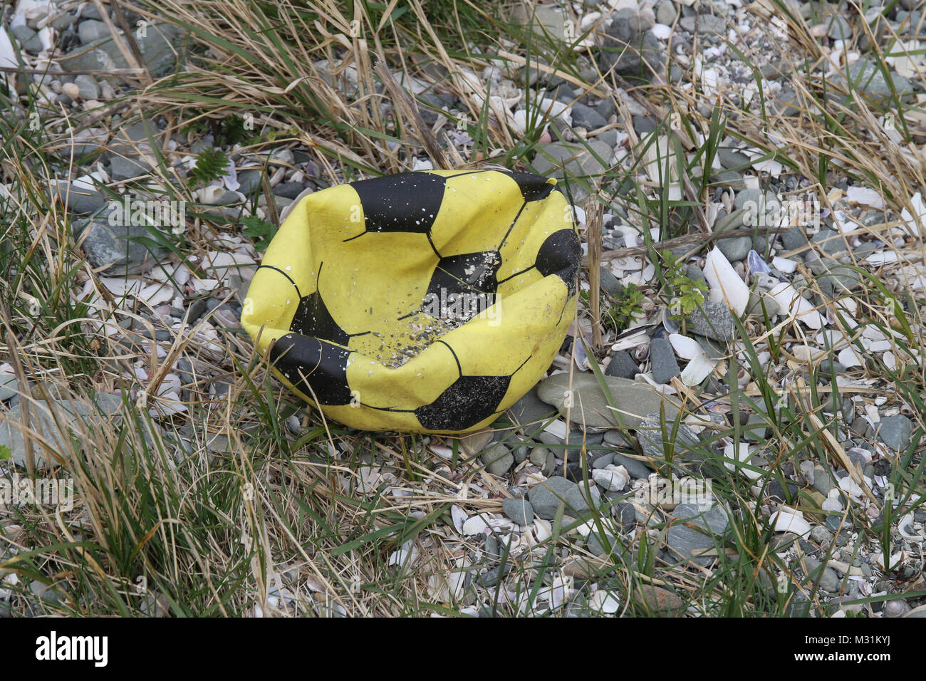 Plastic football washed up on a UK beach Stock Photo - Alamy