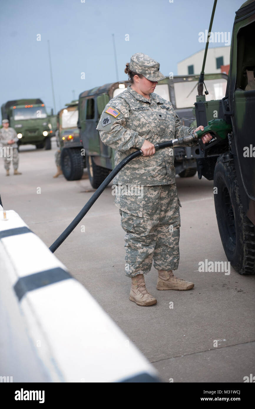 Spc. Kinsey Powers, of Bridge Creek, Okla., fuels her vehicle before ...