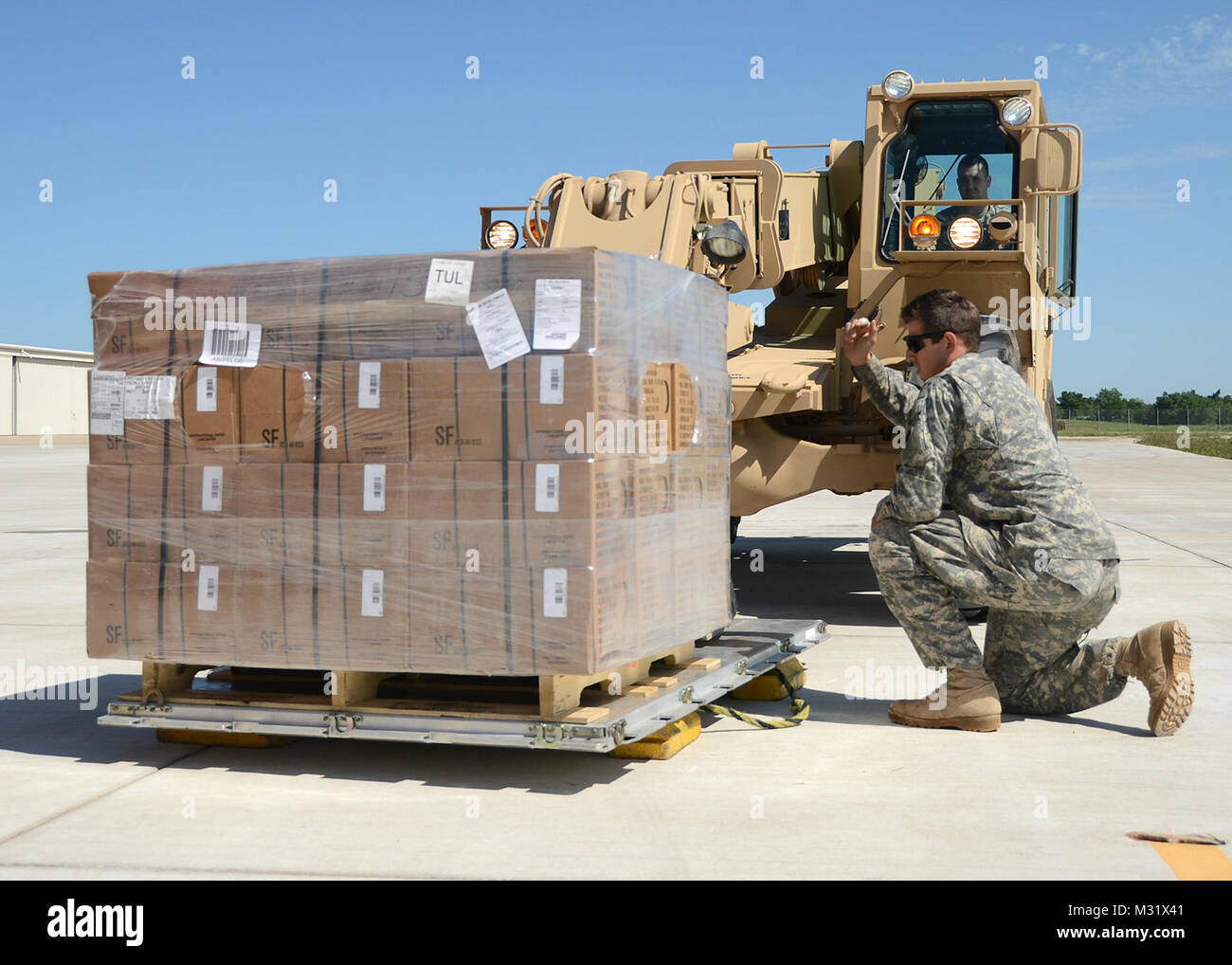 Spc. Travis Wells, of Stratford, Okla., a member of Company B, 700th ...
