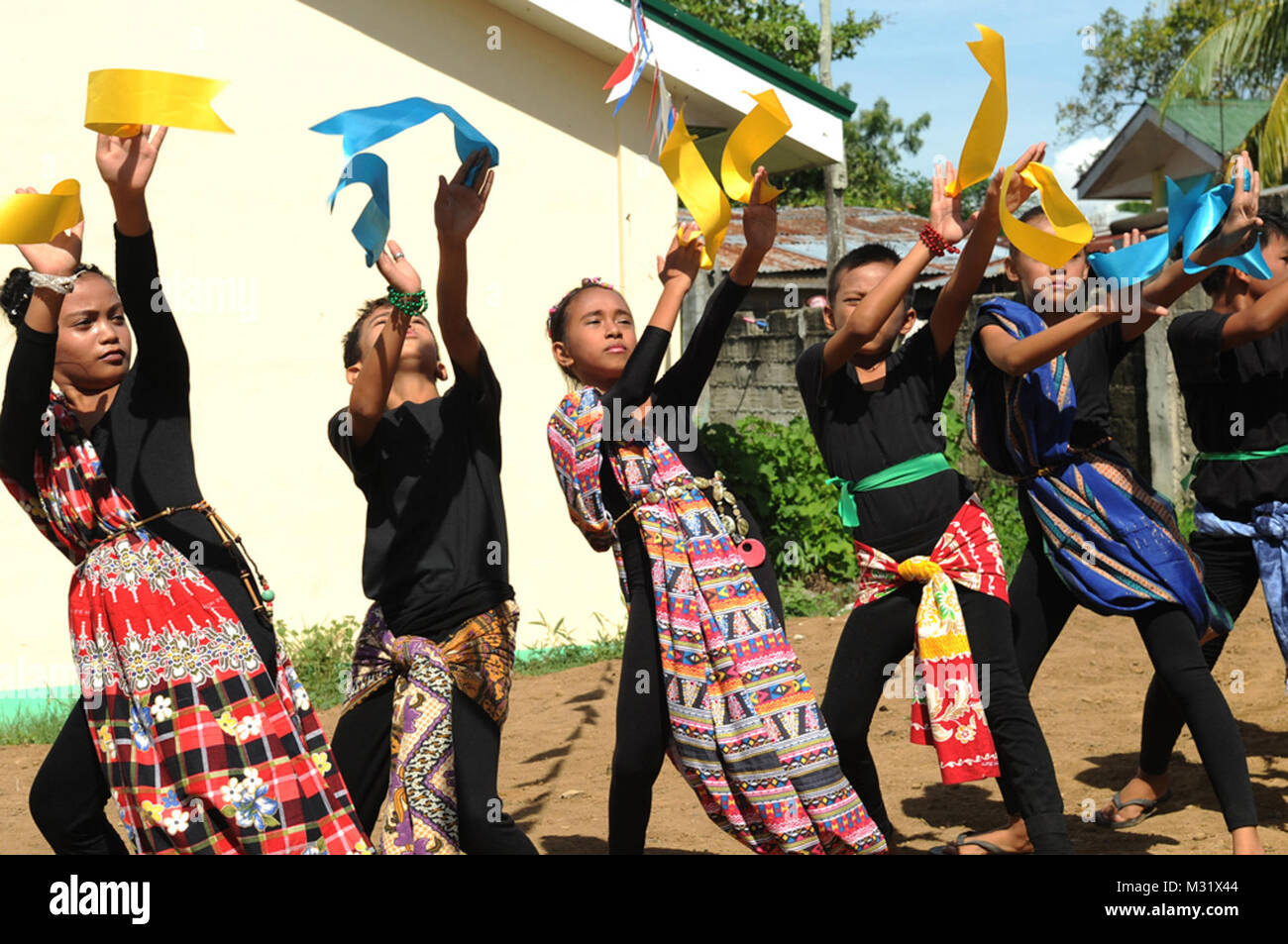 Elementary students perform a dance during the closing ceremony of ...