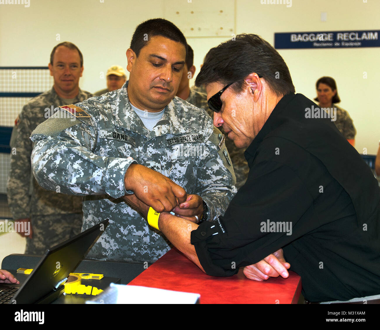 Spc. Christopher Gano, a member of the volunteer Texas State Guard ...