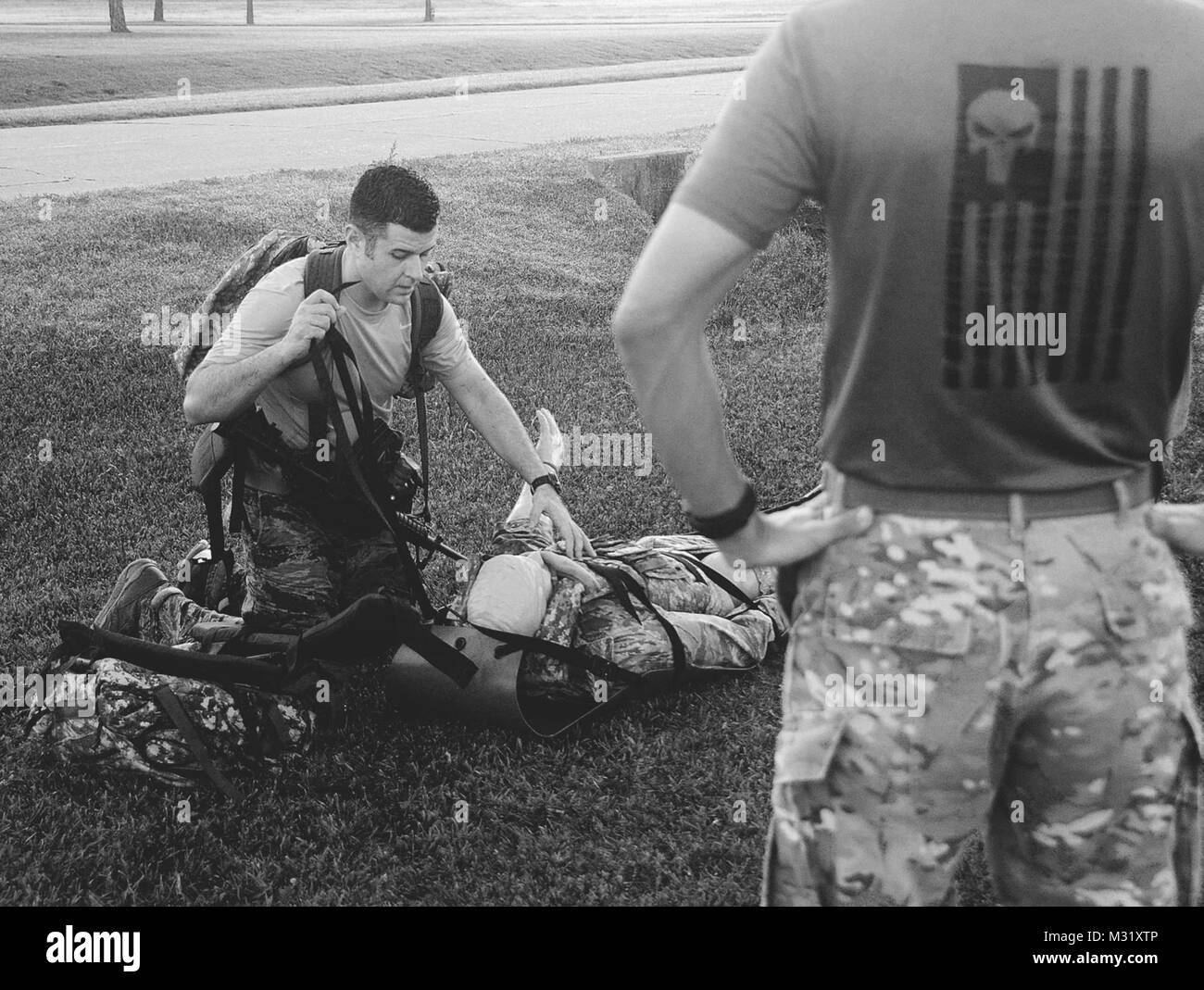 Air Force Staff Sgt. Alejandro Gomez works to securely attach a 175 ...