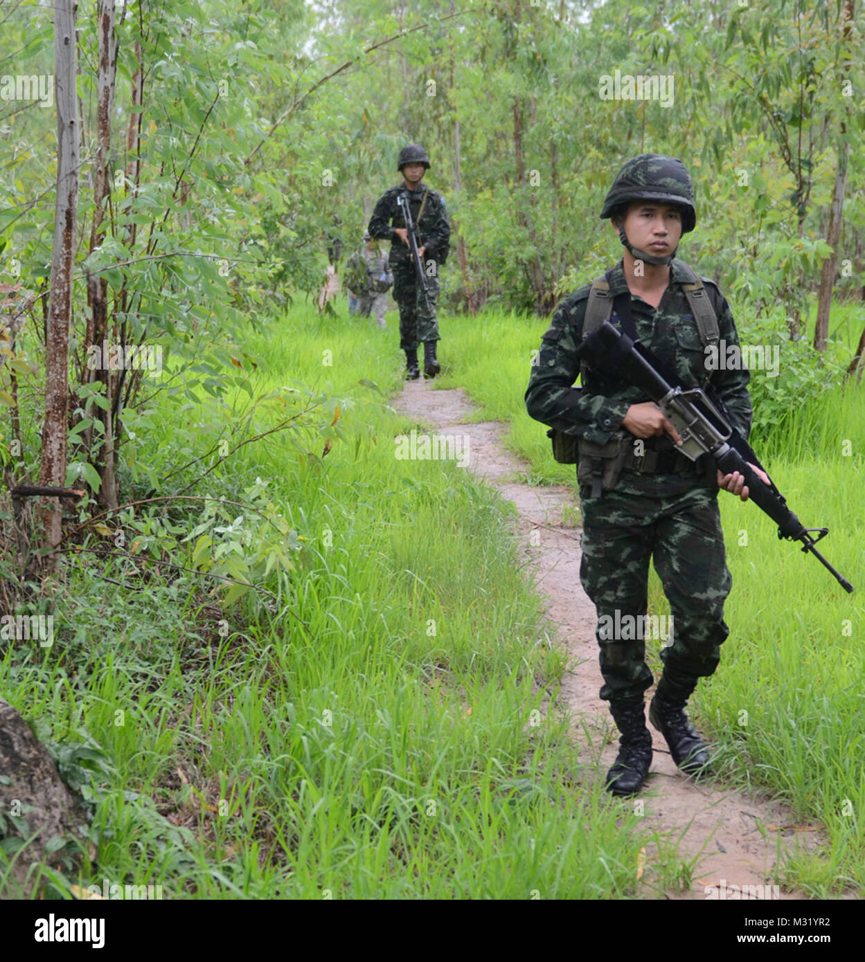 FORT THANARAT, Thailand -- Royal Thai Army Soldiers walk through a ...
