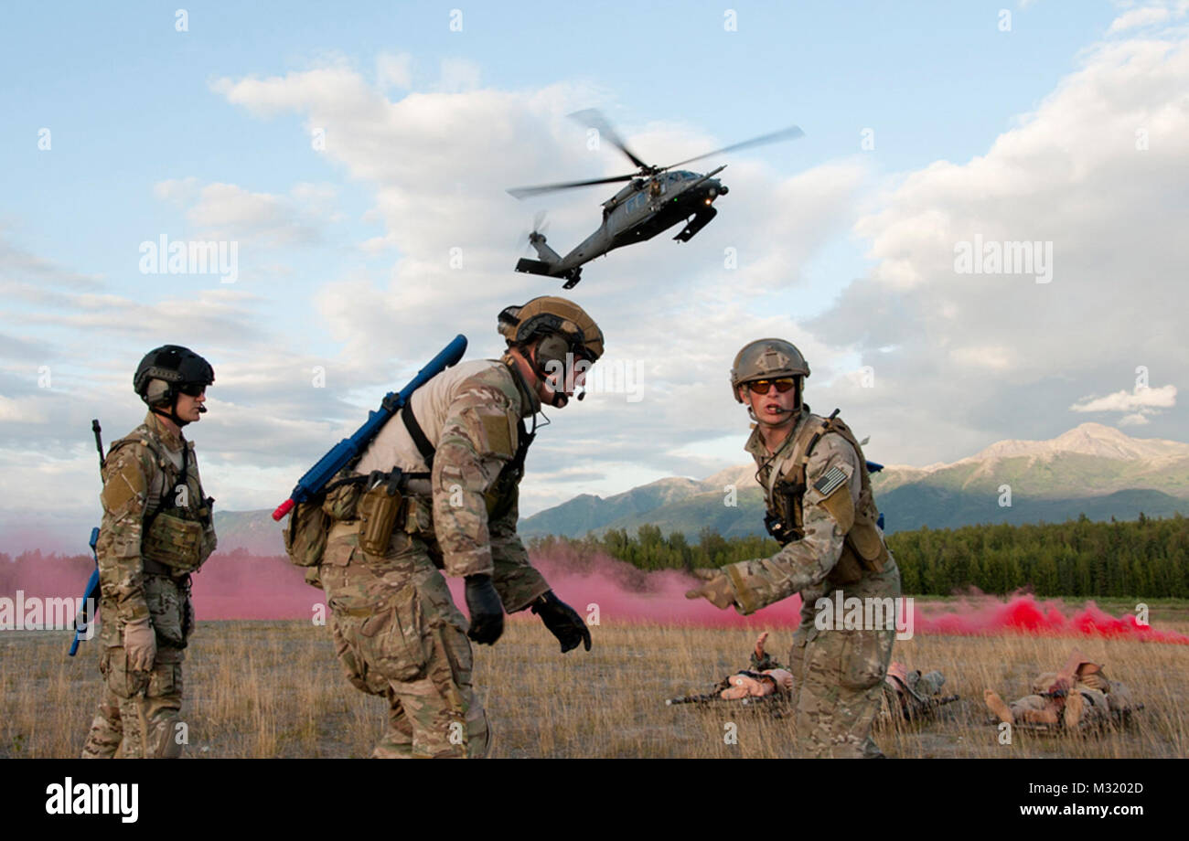 Pararescuemen from the 212th Rescue Squadron, make a plan to evacuate ...
