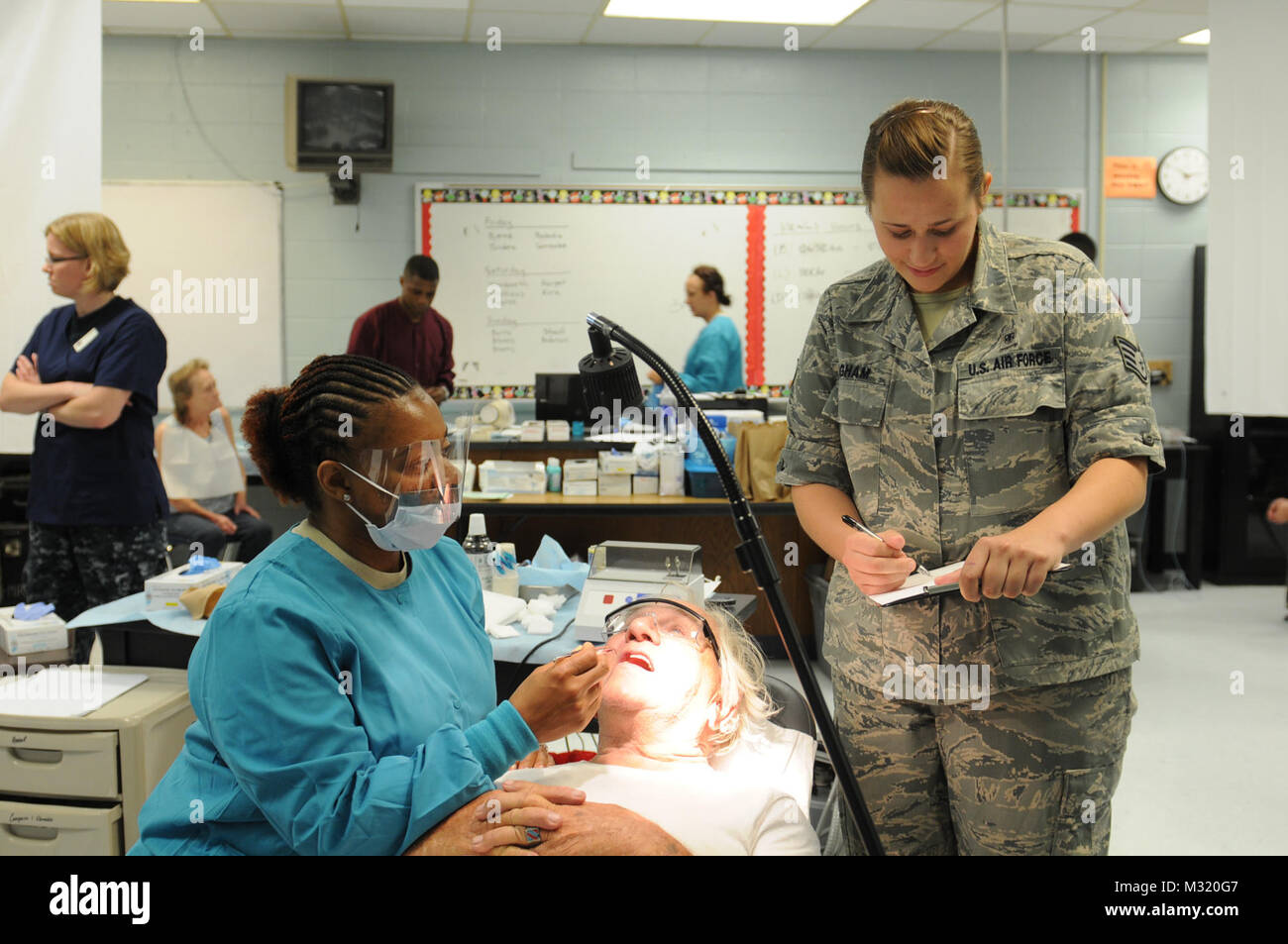 Air Force Maj. Tiffany Harper, a dentist with the 192nd Fighter Wing ...
