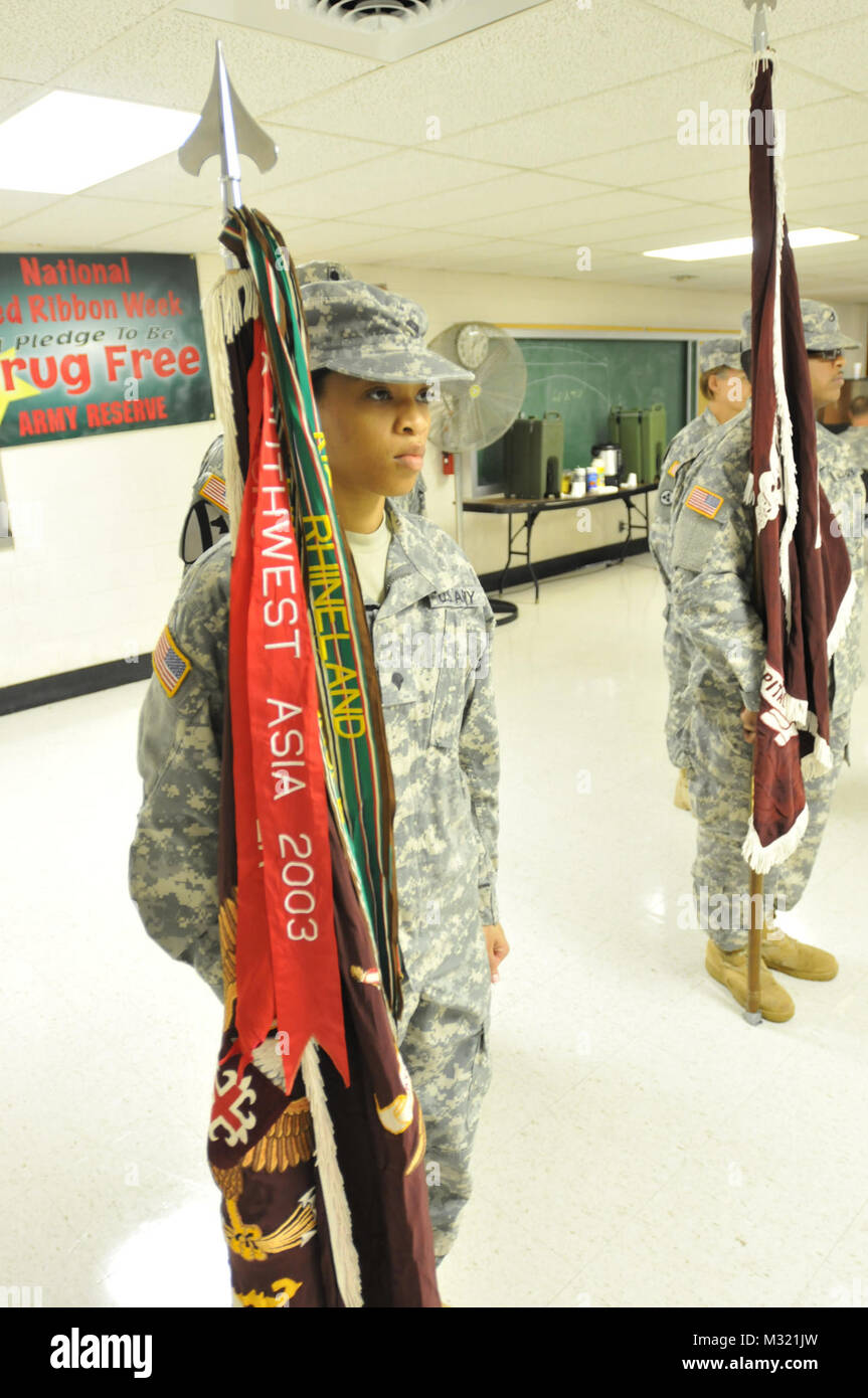A Soldier holds the colors of the 172nd Multifunctional Medical ...