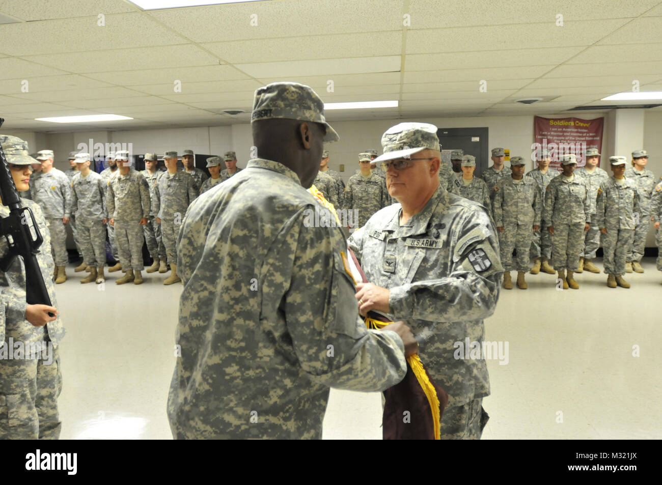Command Sgt. Maj. Robert L. Herbert, the guardian of the brigade colors ...