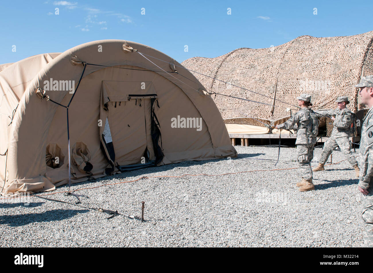 Soldiers of the 542nd Quartermaster Company set up an air-supported ...