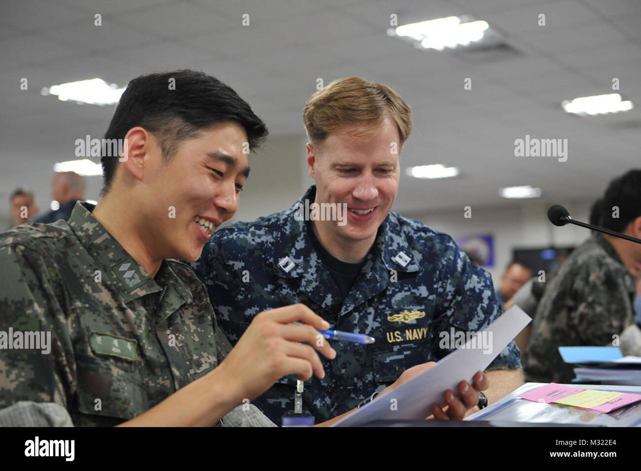 BUSAN, Republic of Korea -- Lt. Kent McNellie, right, interacts with a ...