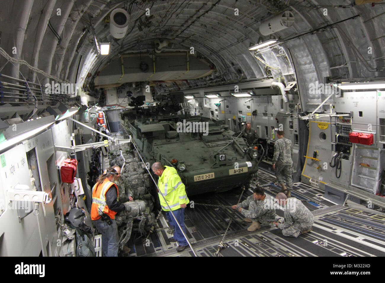 Strykers are loaded into aircraft at Fort Wainwright, Alaska’s Ladd ...