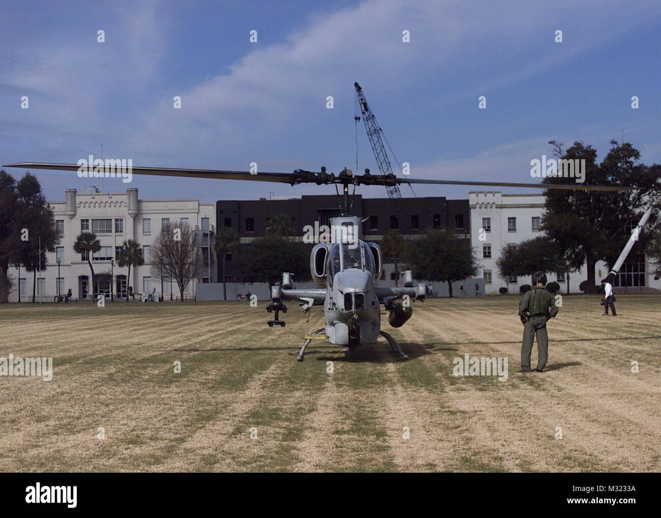 An AH-1W Cobra prepares to take off after a visit by Marines and ...