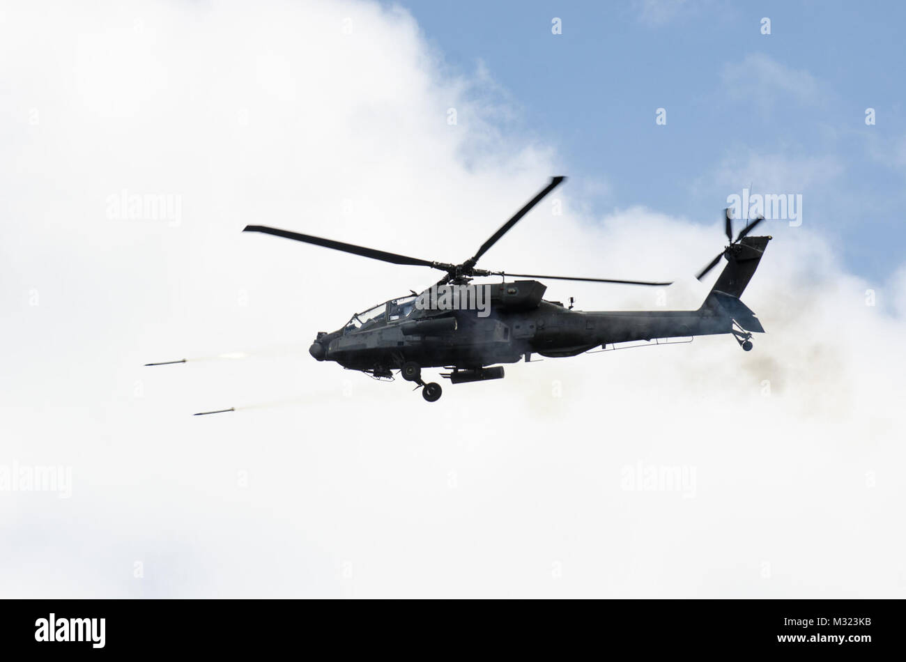 AH-64 Apache helicopters launch Hellfire missiles on to targets during ...