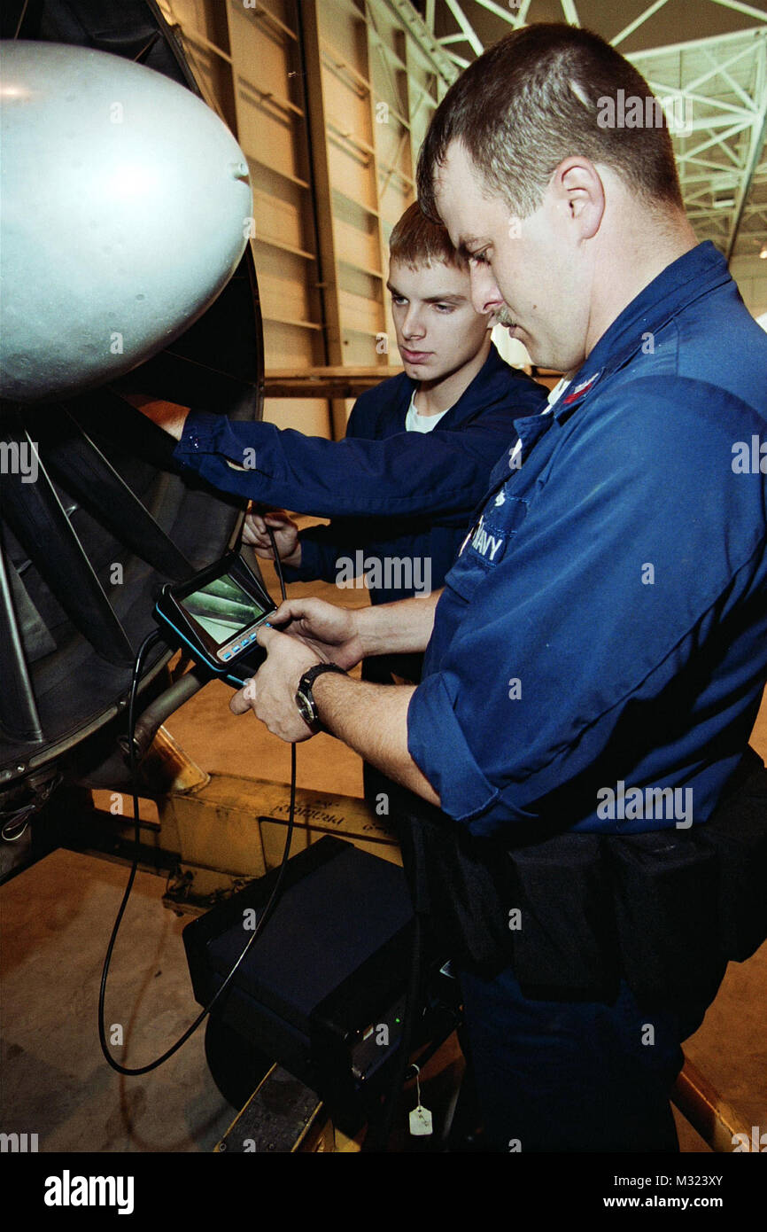 Maintainers at VR-56 use the video probe XL on the Pratt Whitney JT8D ...