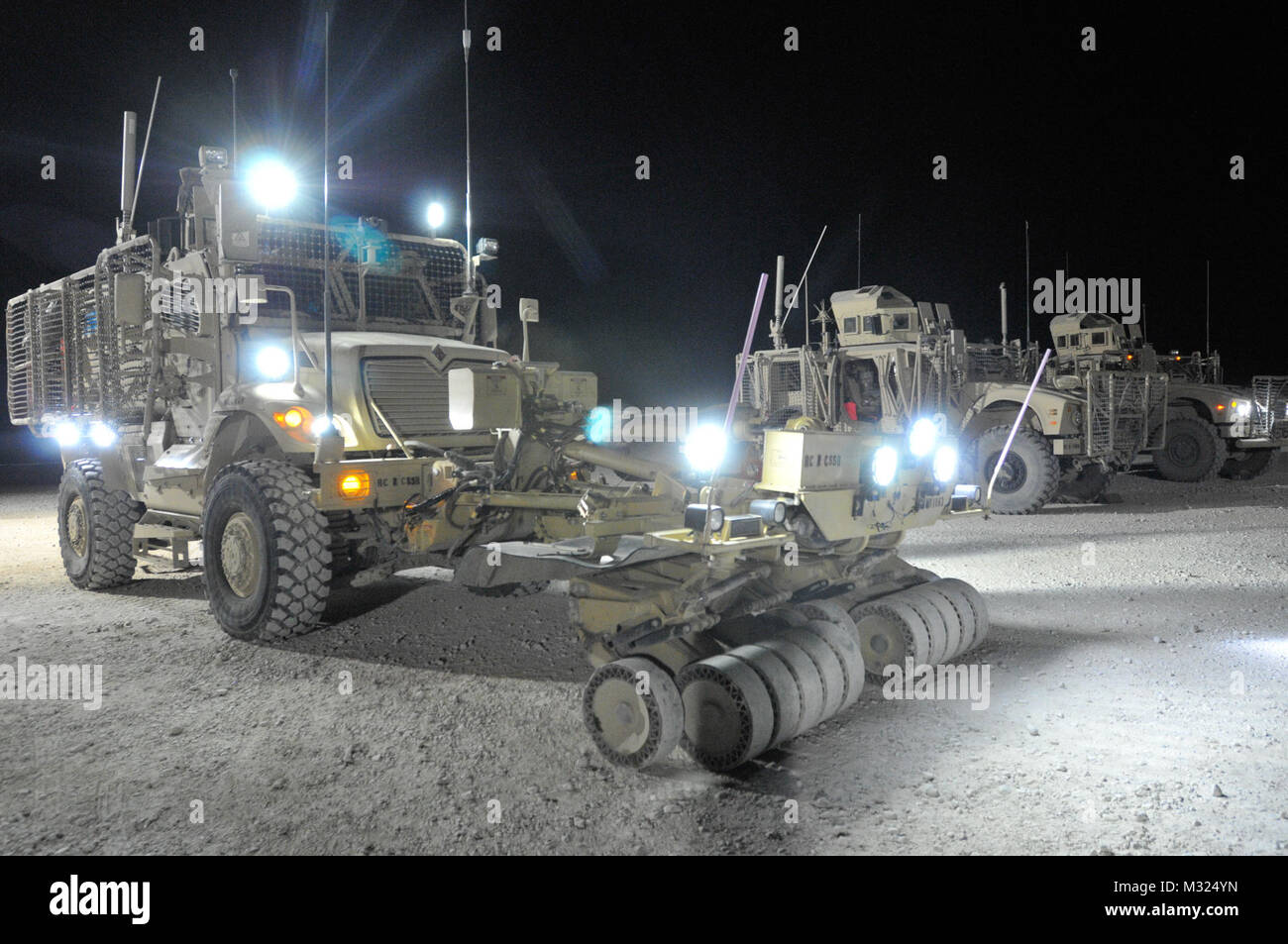 In the shade of night, soldiers of the 1230th Transportation Company ...