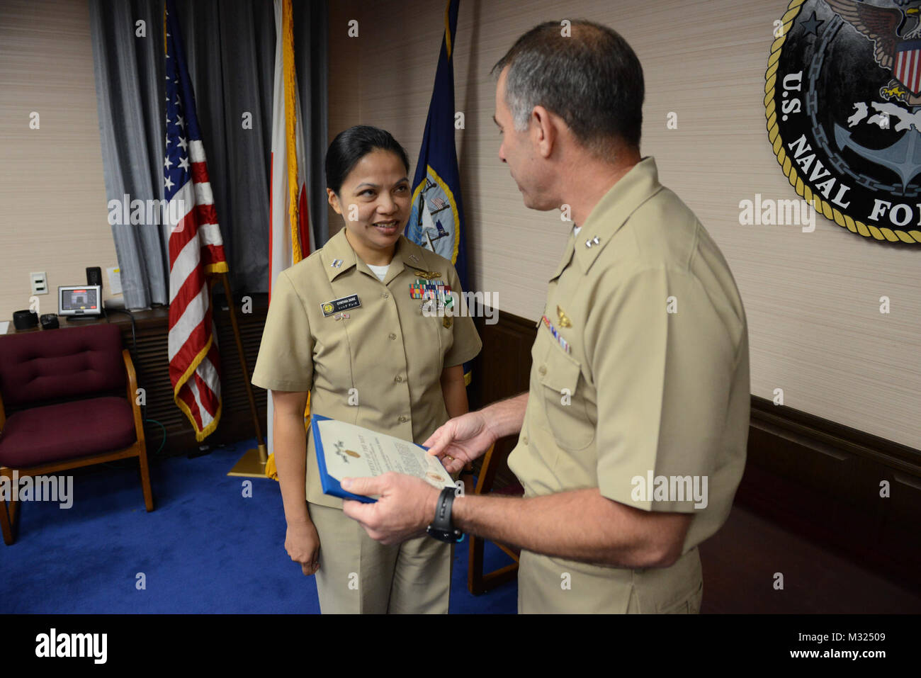 Lt. Cynthia Duke receives the Navy and Marine Corps commendation award ...