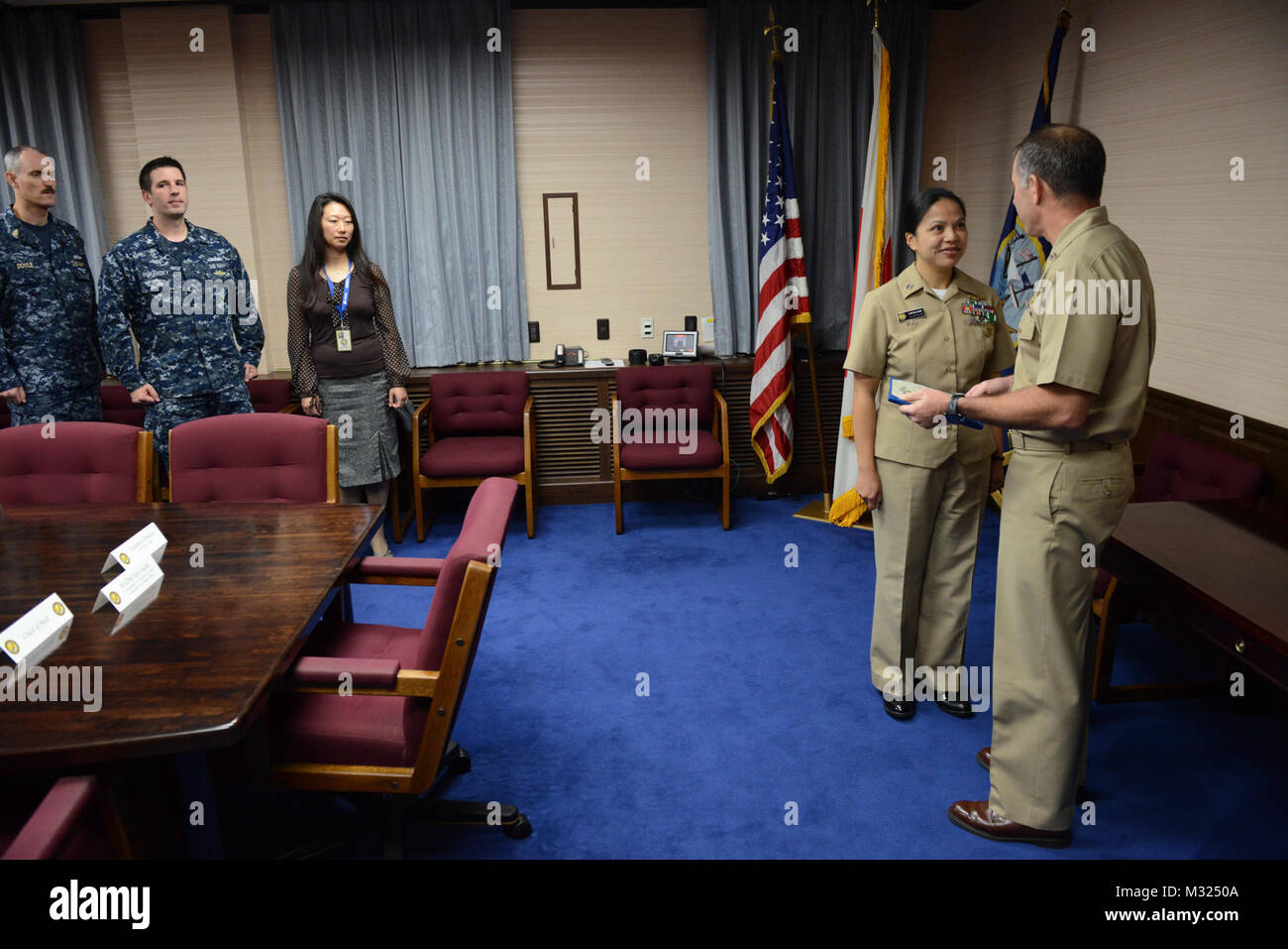 Lt. Cynthia Duke receives the Navy and Marine Corps commendation award ...