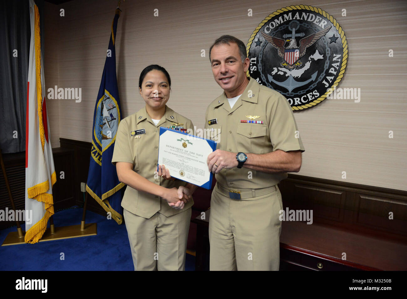 Lt. Cynthia Duke receives the Navy and Marine Corps commendation award ...