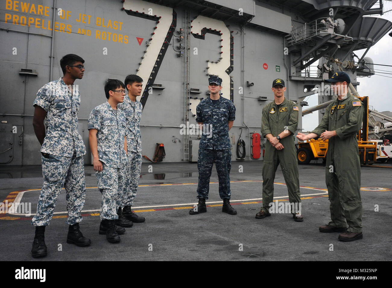 Discusses flight deck operations with Republic of Singapore navy ...