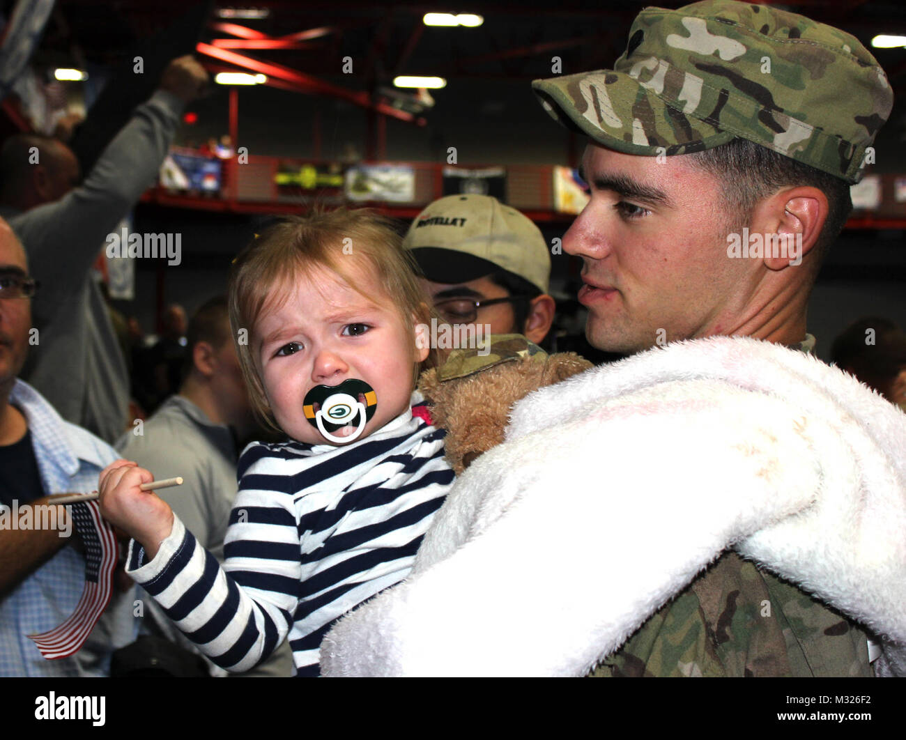 Overwhelmed with emotion, two-year-old Maddelynn Diener embraces her ...